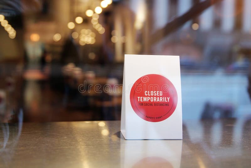 Closed Temporarily Sign in the Window of a Restaurant Displaying the ...