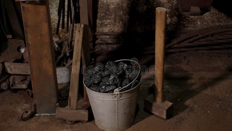 Close-up of Coal in a Bucket in the Forge. Workplace in the Forge Stock ...