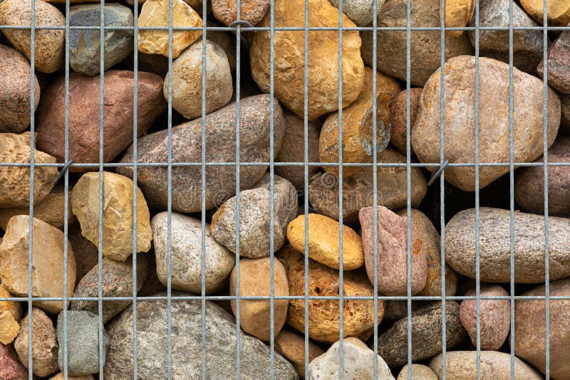 Close-up of Cobblestones Laying Behind Metal Lattice Work Stock Image ...