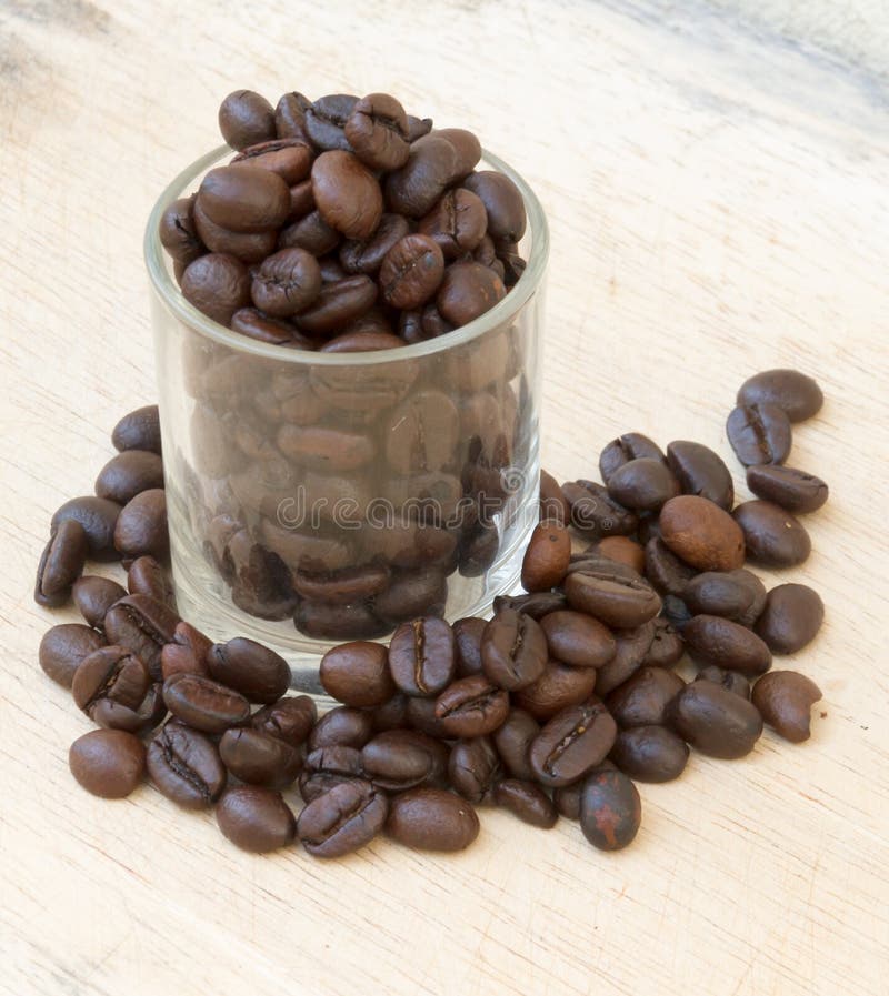 Close Up of Coffee Beans and a Cup Full of Coffee Stock Photo - Image ...