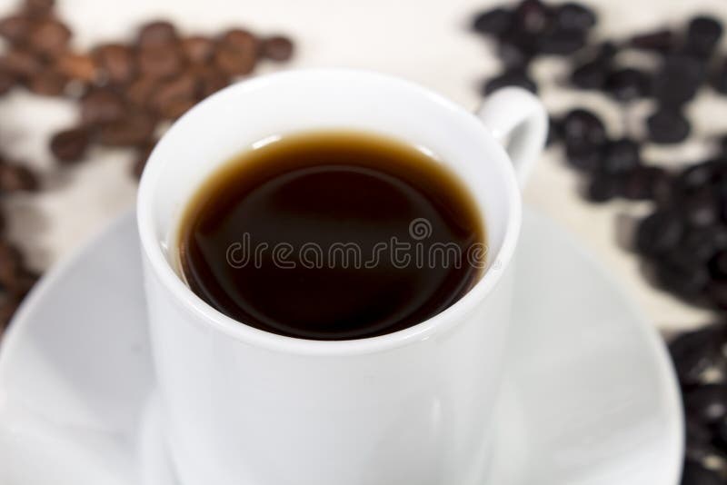 Close-up of Coffee Cup in Front of Different Coffee Beans Stock Image ...