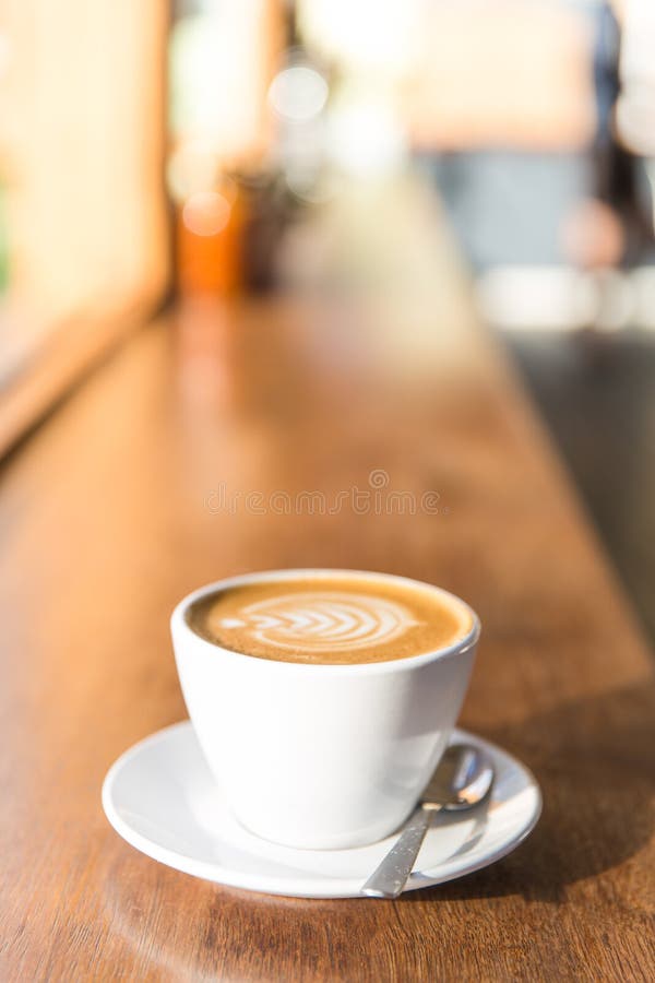 Coffee Cup with Spoon on Cafe Bench Stock Image - Image of rustic, head ...