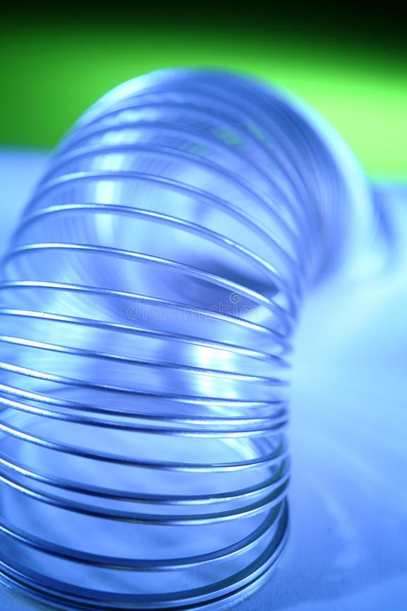 Close Up of a Coiled Spring Editorial Image - Image of coiled, blue ...