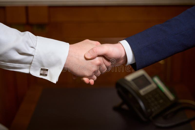 Close Up of Colleagues Shaking Hands in Office Stock Image - Image of ...