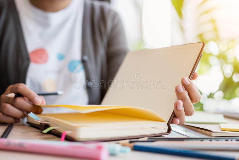 Close Up of College Student Hands Open Notebook for Writing Something ...