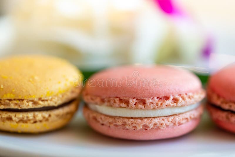 Close-up Colorful Biscuit Macaroons. Sweet Macarons on White Plates ...