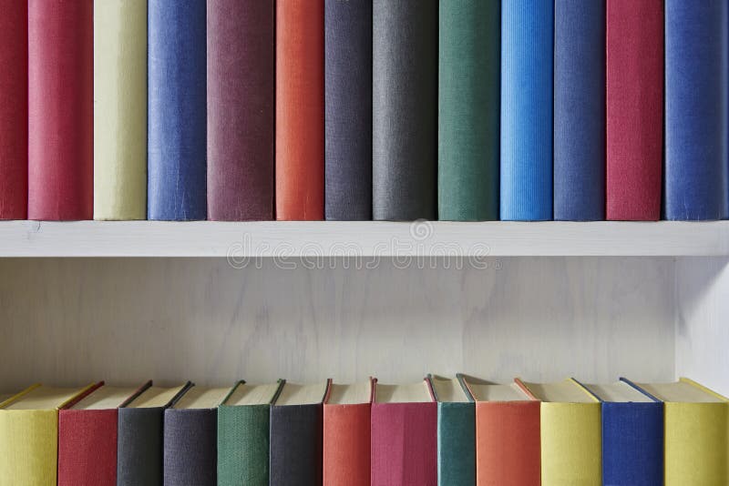 Close Up of Colorful Books in a White Shelf Stock Image - Image of ...