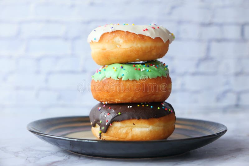 Close Up of Colorful Homemade Donuts on Plate Stock Photo - Image of ...