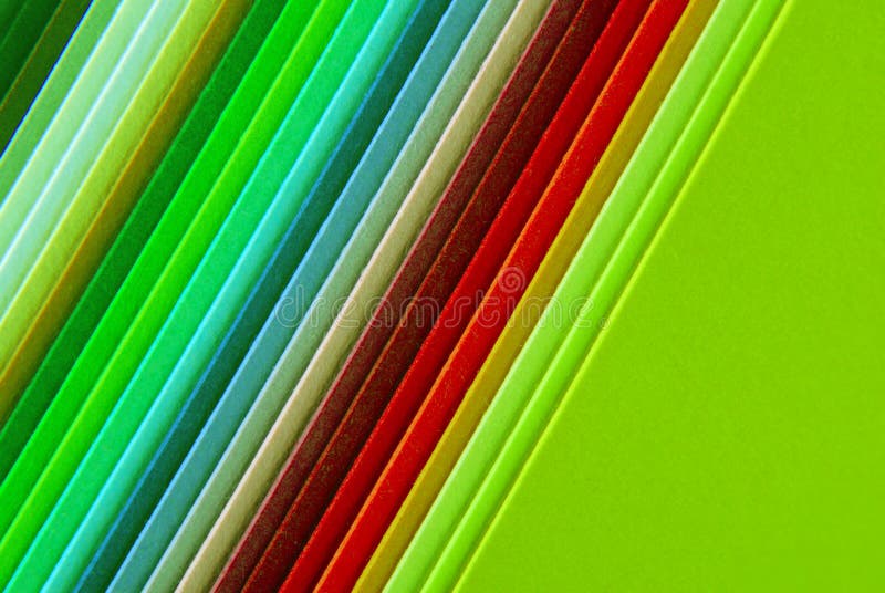 Colorful Paper Stacks and Sticky Notes Arranged Neatly Against a Blue ...