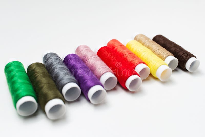 Close-up of Colourful Thread Spools on White Table. Stock Image - Image ...