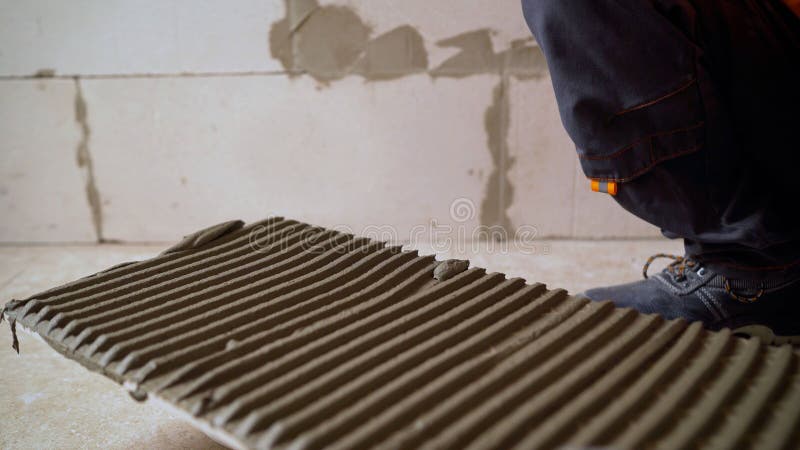 Close-up of a Layer of Cement on a Tile. the Process of Laying Tiles on ...