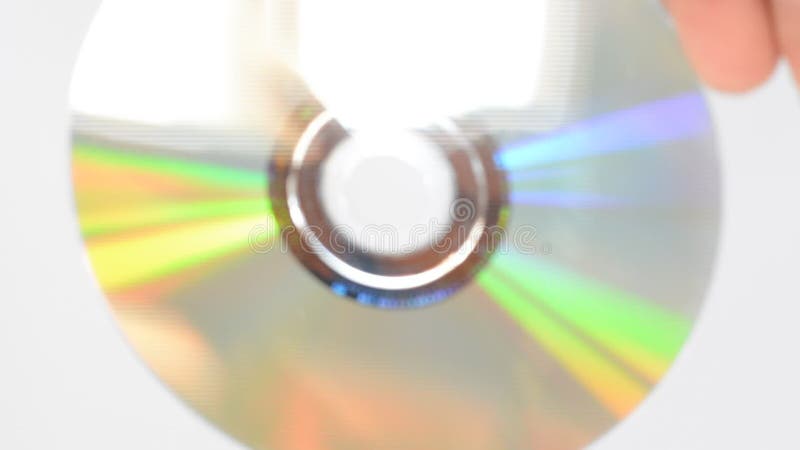 Close Up of Compact Disc. Man Hand Rotate with CD Rom Infront of Camera ...