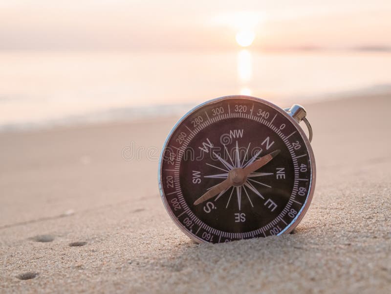 Close Up Compass on the Beach with Sunlight Stock Photo - Image of ...