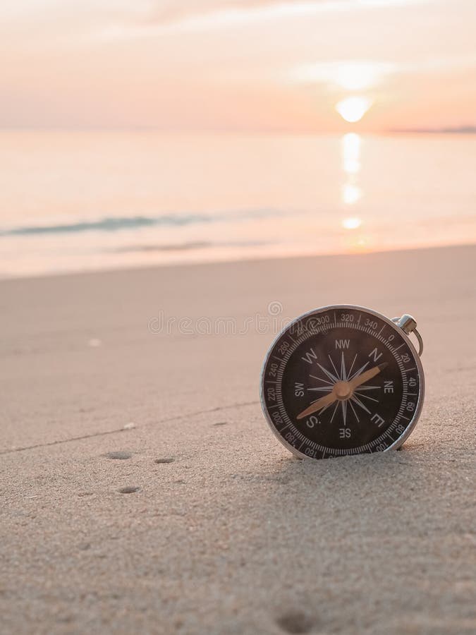 Close-up Compass on the Beach with Sunlight Stock Image - Image of ...