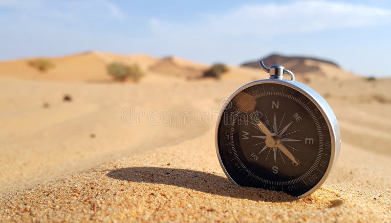 Compass in the Desert Sand: Finding Your Way Under a Vast Sky Stock ...