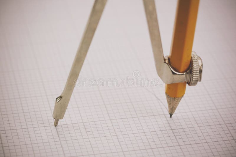 Close Up of a Compass on Graph Paper Stock Image - Image of instrument ...
