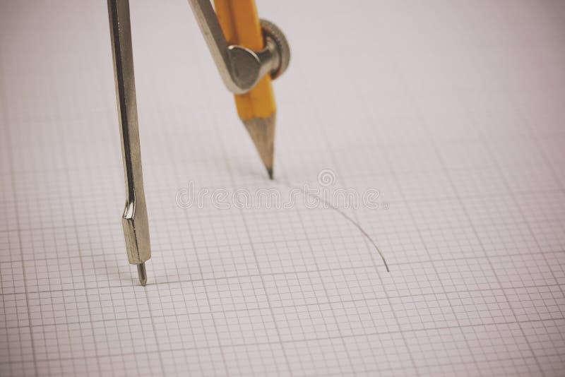 Close Up of a Compass on Graph Paper Stock Image - Image of ...