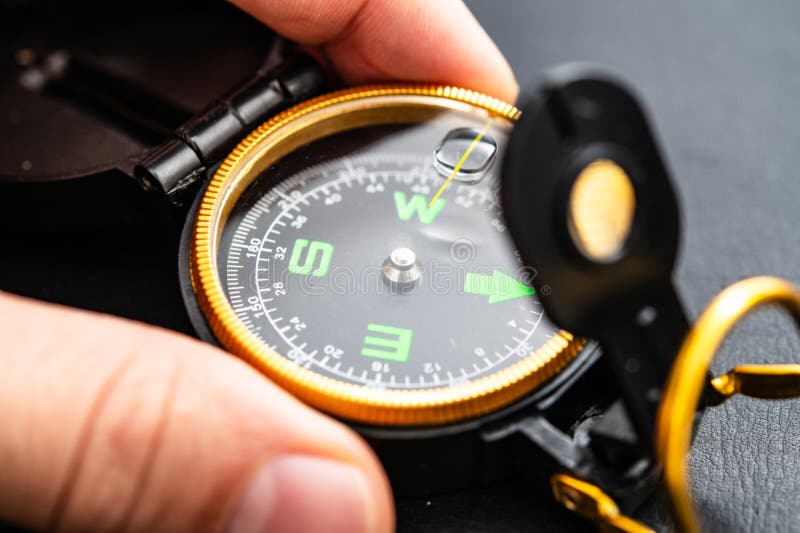Close-Up of a Compass in Hand, Navigating Adventure and Travel ...