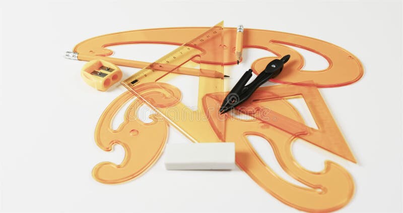 Close Up of Compass, Pencil, Sharpener, Eraser and Rulers on White ...