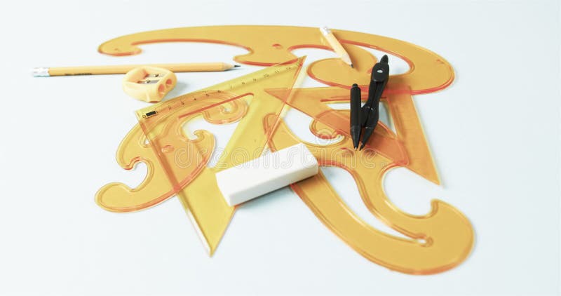 Close Up of Compass, Pencil, Sharpener, Eraser and Rulers on White ...