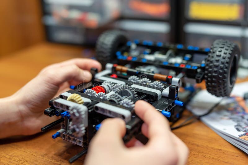 Close Up on a Complex Gear Box of Tech Constructor in Hands of a Boy ...