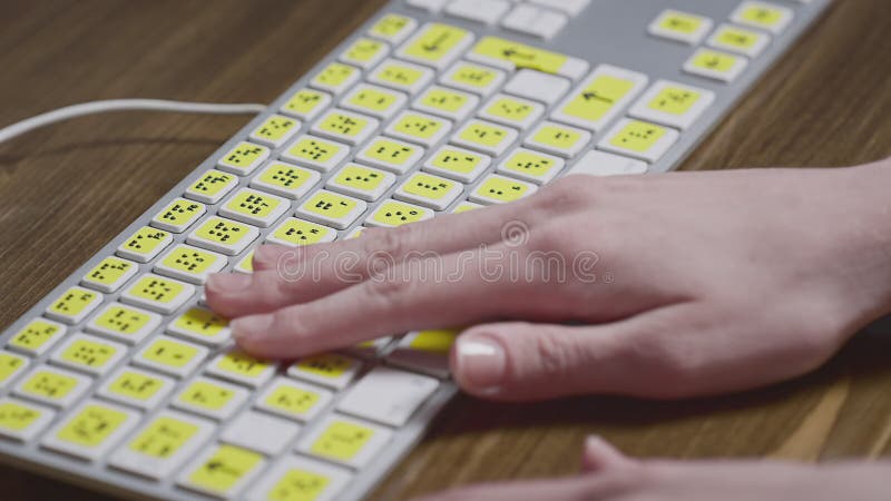 Close-up of a Computer Keyboard with Braille. a Blind Girl is Typing ...