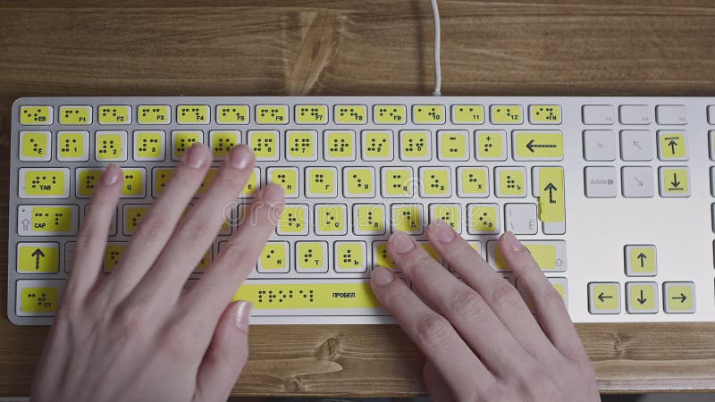 Close-up of a Computer Keyboard with Braille. a Blind Girl is Typing ...