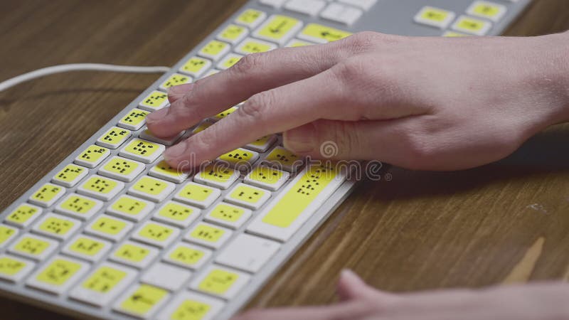 Close-up of a Computer Keyboard with Braille. a Blind Girl is Typing ...