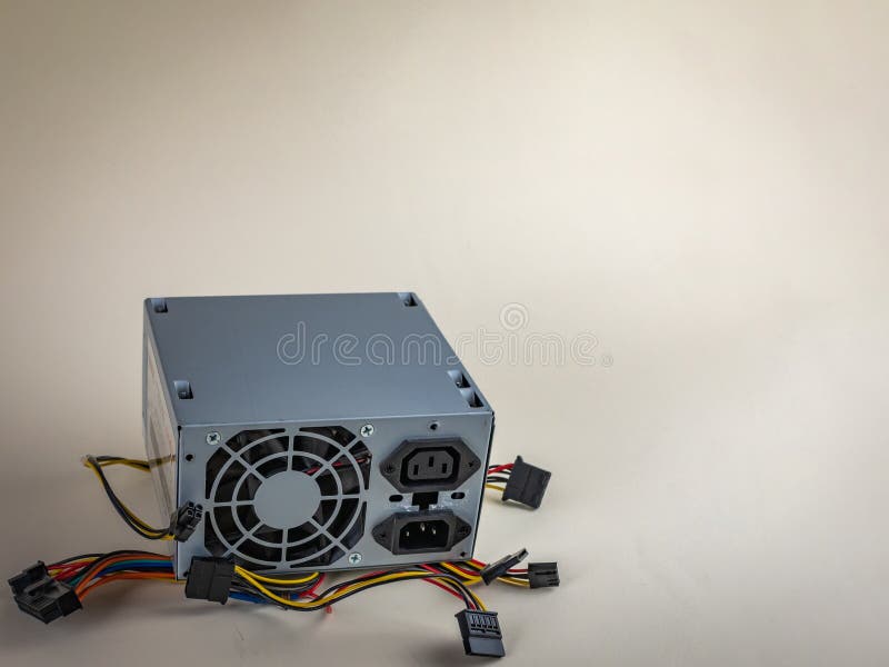 Close-up of a Computer Power Supply on a Light Background with Multi ...