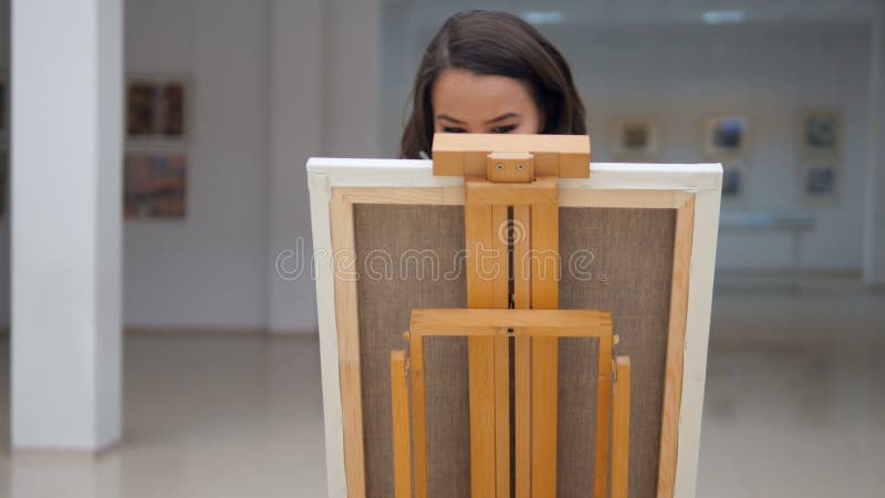 The Close-up of the Concentrated Painter Girl, Thinking about the ...