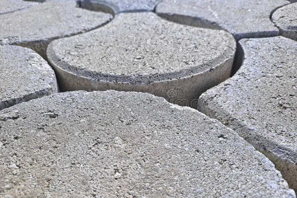 Close-up of Concrete Self Locking Flooring Blocks in Curved Shape in a ...