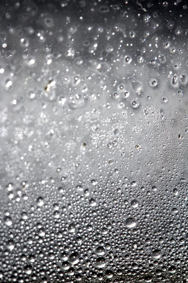 CLose Up of Condensation Bubbles and Marks on a Window Water Background ...