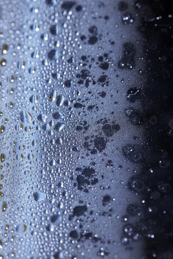 CLose Up of Condensation Bubbles and Marks on a Window Water Background ...