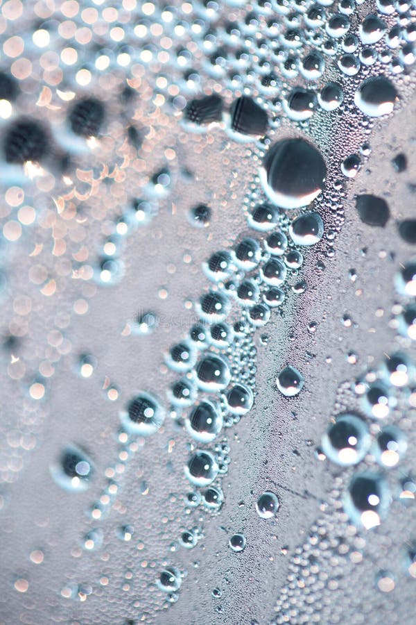 Close Up of Condensation Water Liquid Bubbles and Drips on Glass from ...
