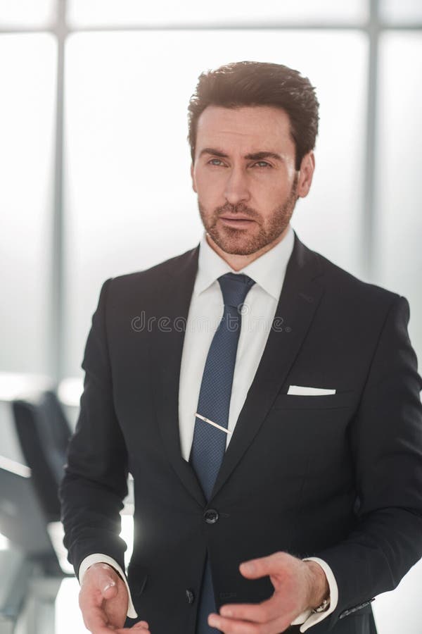 Close Up.confident Businessman Standing in Office Stock Photo - Image ... Close Up.confident Businessman Standing in Office Stock Photo - Image ...