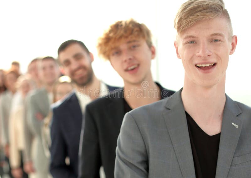 Confident Guy Standing in Front of a Group of Young People Stock Photo ...