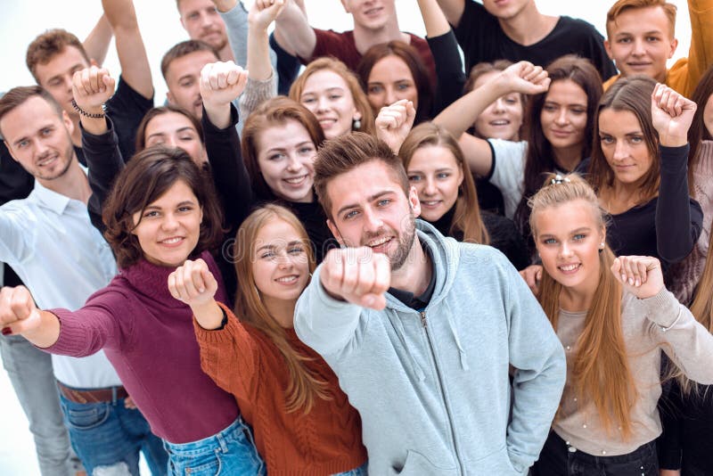 Close Up. Confident Guy Standing among His Friends Stock Image - Image ...