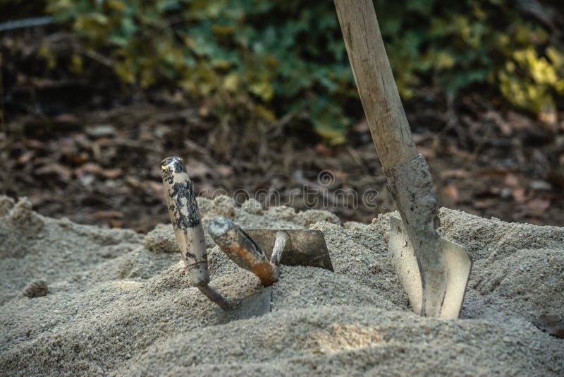Construction Tools Stuck in the Sand Stock Photo - Image of used, room ...