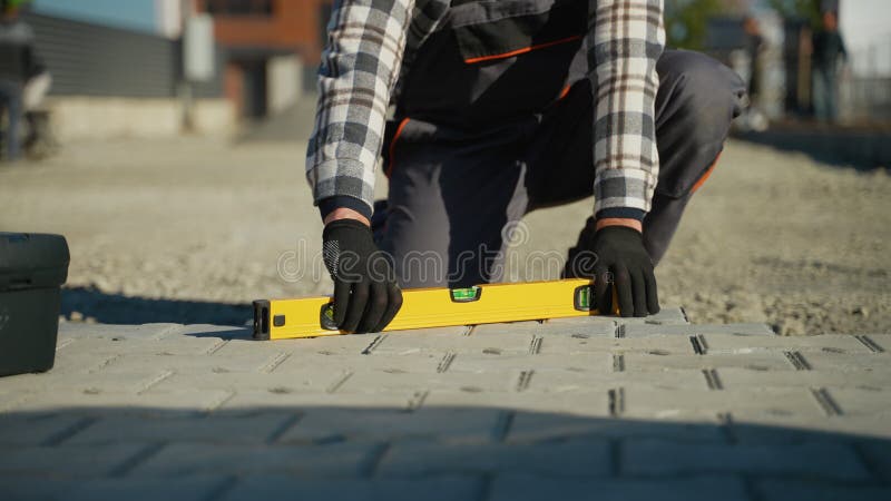 Worker Adjusting Paving Stones with Level Stock Video - Video of stone ...