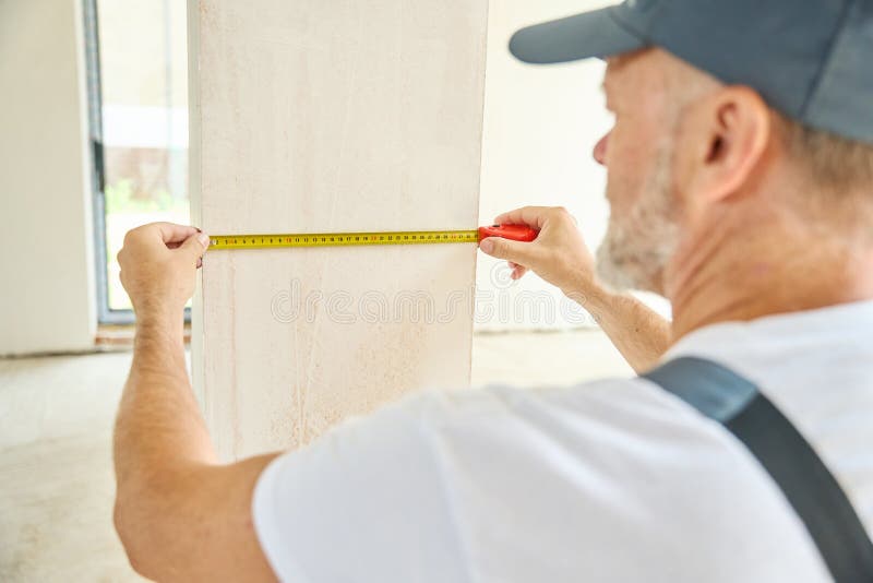 Close-up of Builder Measuring Width of Walls at Construction Site Stock ...