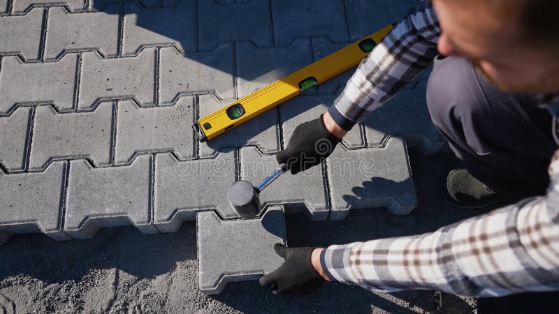 Worker Installing Paving Slabs with Hammer Stock Footage - Video of ...