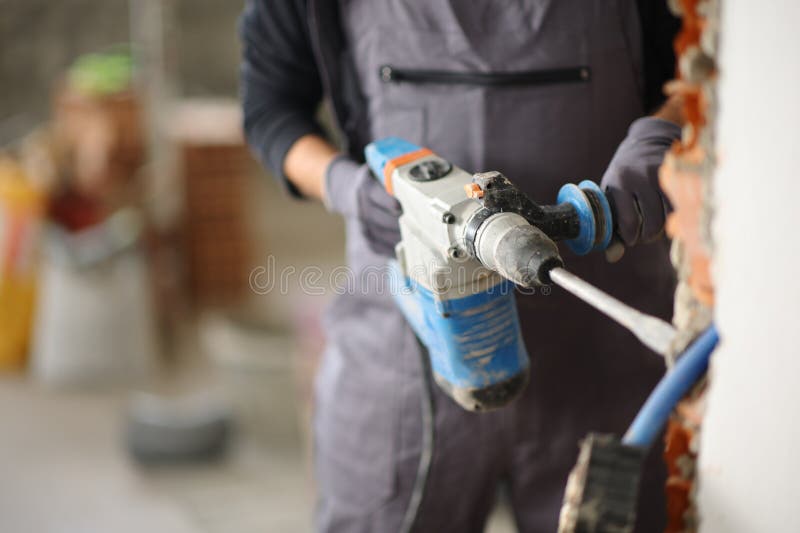 Close Up of a Construction Worker Using Rotary Hammer Stock Image ...