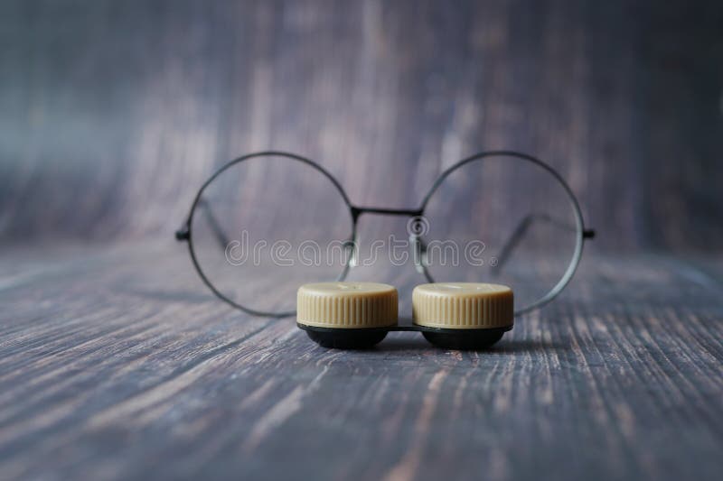 Close Up of Contact Lens and Eyeglass on Table Stock Image - Image of ...