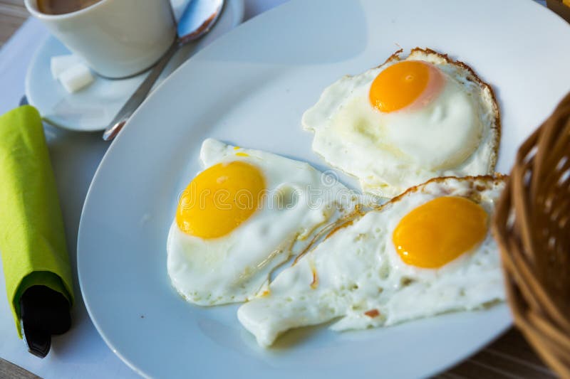 Cooked Eggs with Yolk Served at Plate on Table, Breakfast in Cafe Stock ...