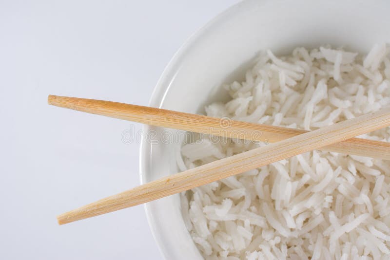 Close-Up Cooked Rice with Wooden Chopsticks Stock Photo - Image of ...