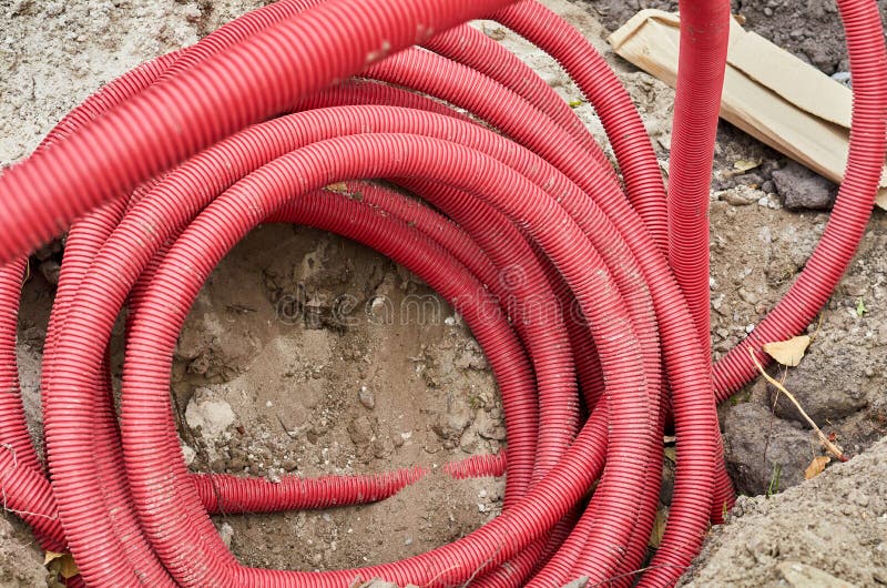 Close Up of Corrugated Red Drain Pipe Lays on the Ground. Stock Photo ...