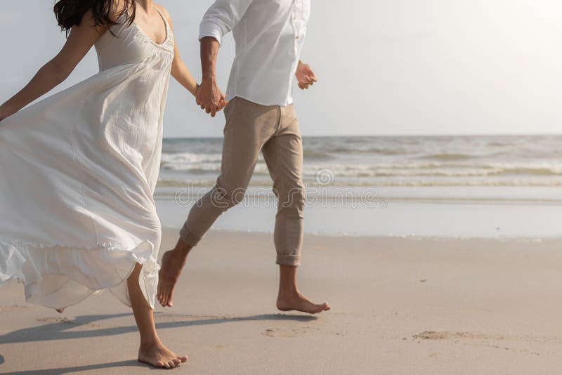 Close Up Couple Holding Hands Walking on Beach. Romantic Beach Vacation ...