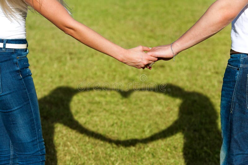 Close Up of Couples Hands Together with Love Sign. Stock Image - Image ...