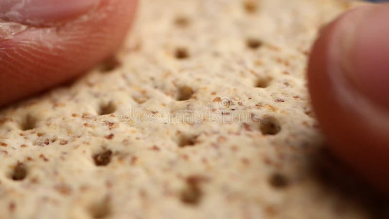 Close Up of Cracking a Crisp Whole Grain Cracker Stock Footage - Video ...