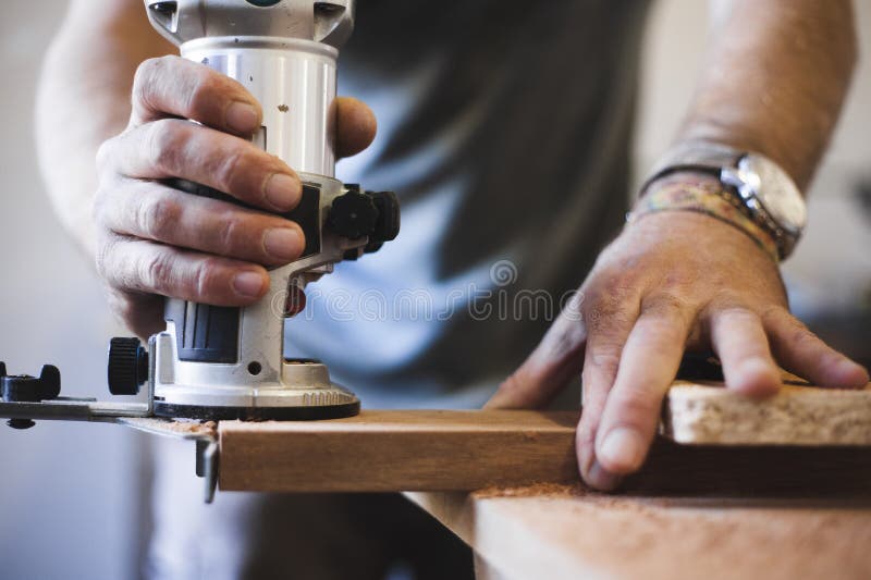 Close-up of Craftsman Hands Working Wood with a Router Stock Image ...